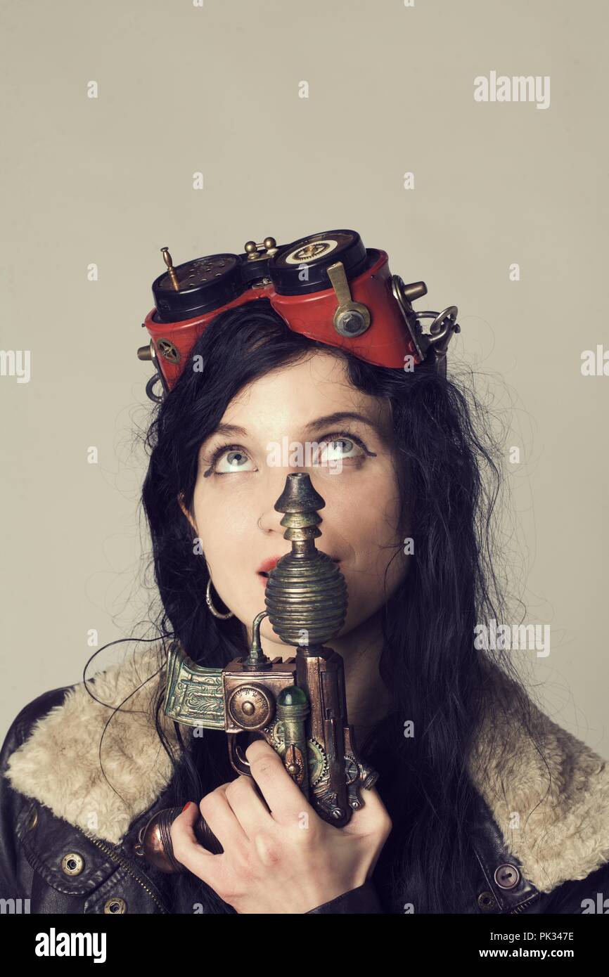 headshot dieselpunk girl with ray gun Stock Photo - Alamy