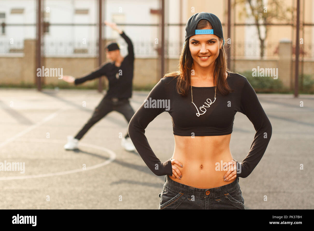 Portrait of a beautiful dancer girl on a background of the hip hop ...