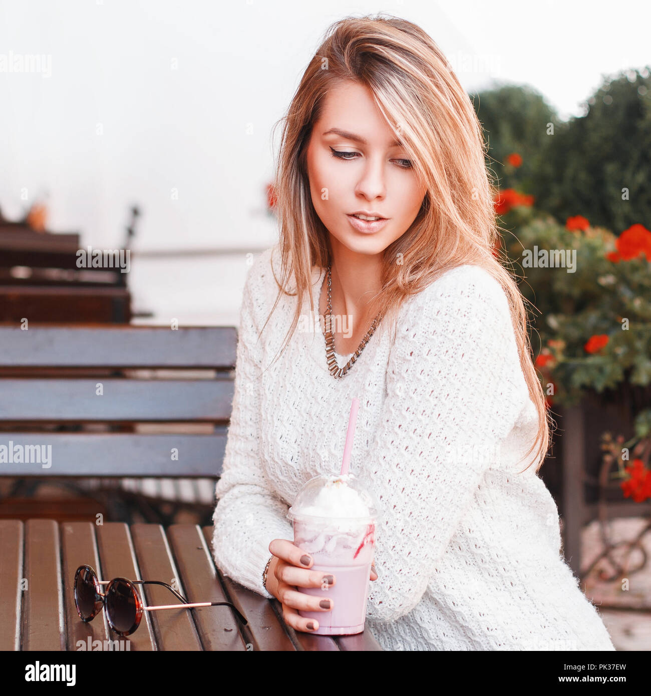 Portrait of a beautiful girl in a cafe. Drinks cocktail and relax Stock ...