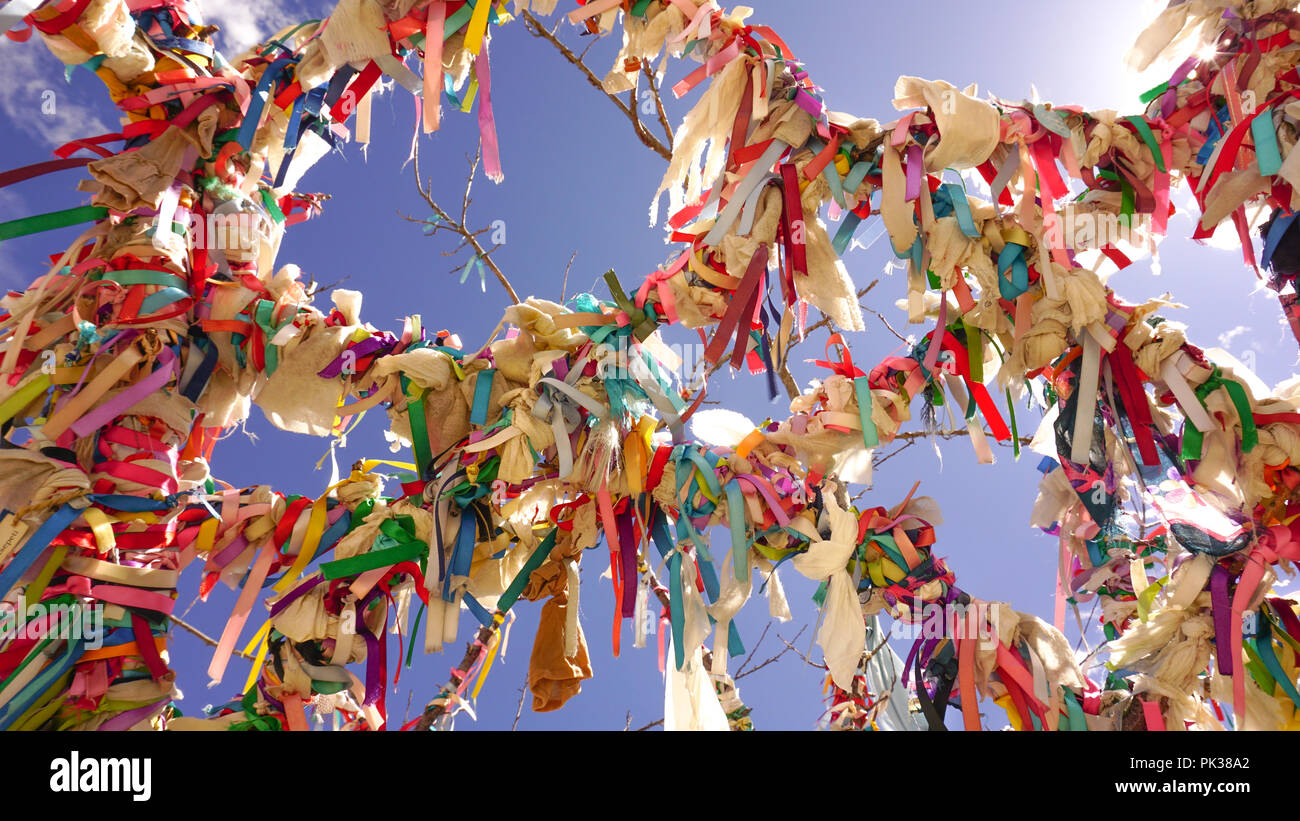 A Colorful Wish Tree Under The Beautiful Blue Sky with a lot of ropes ...