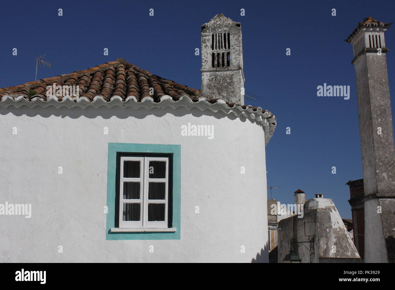 Beautiful old white house with light blue window frames, typical ...