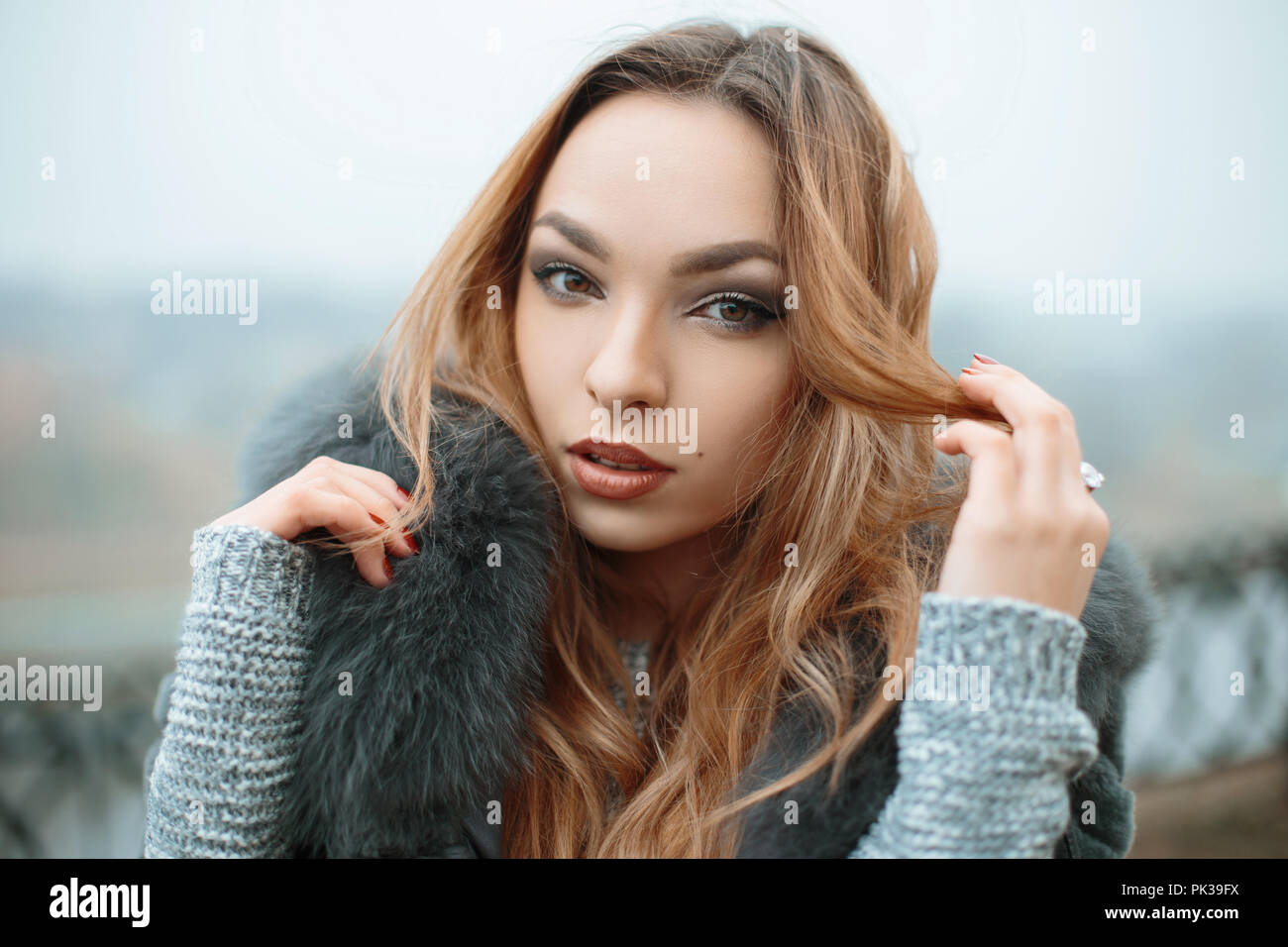 Portrait of a beautiful young girl on a background of fog Stock Photo ...