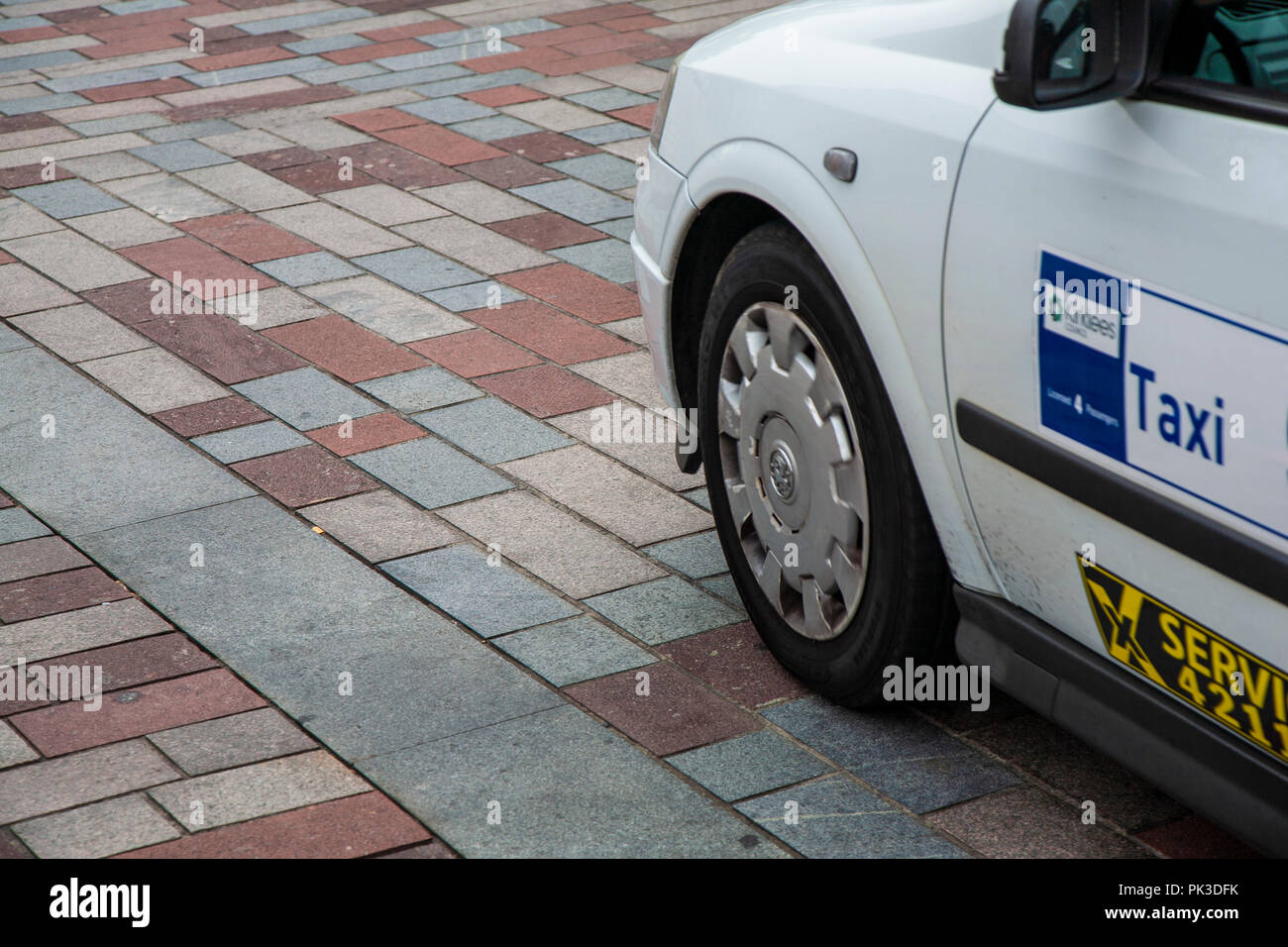 parked on a street Taxi waiting at the paved area at St Georges Square ...