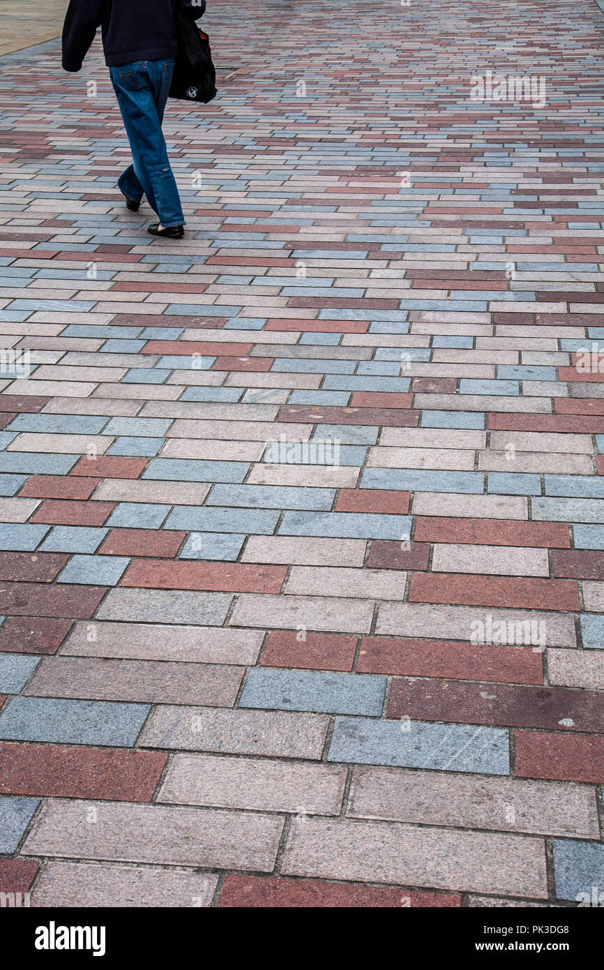 Legs of man on paving slabs hi-res stock photography and images - Alamy