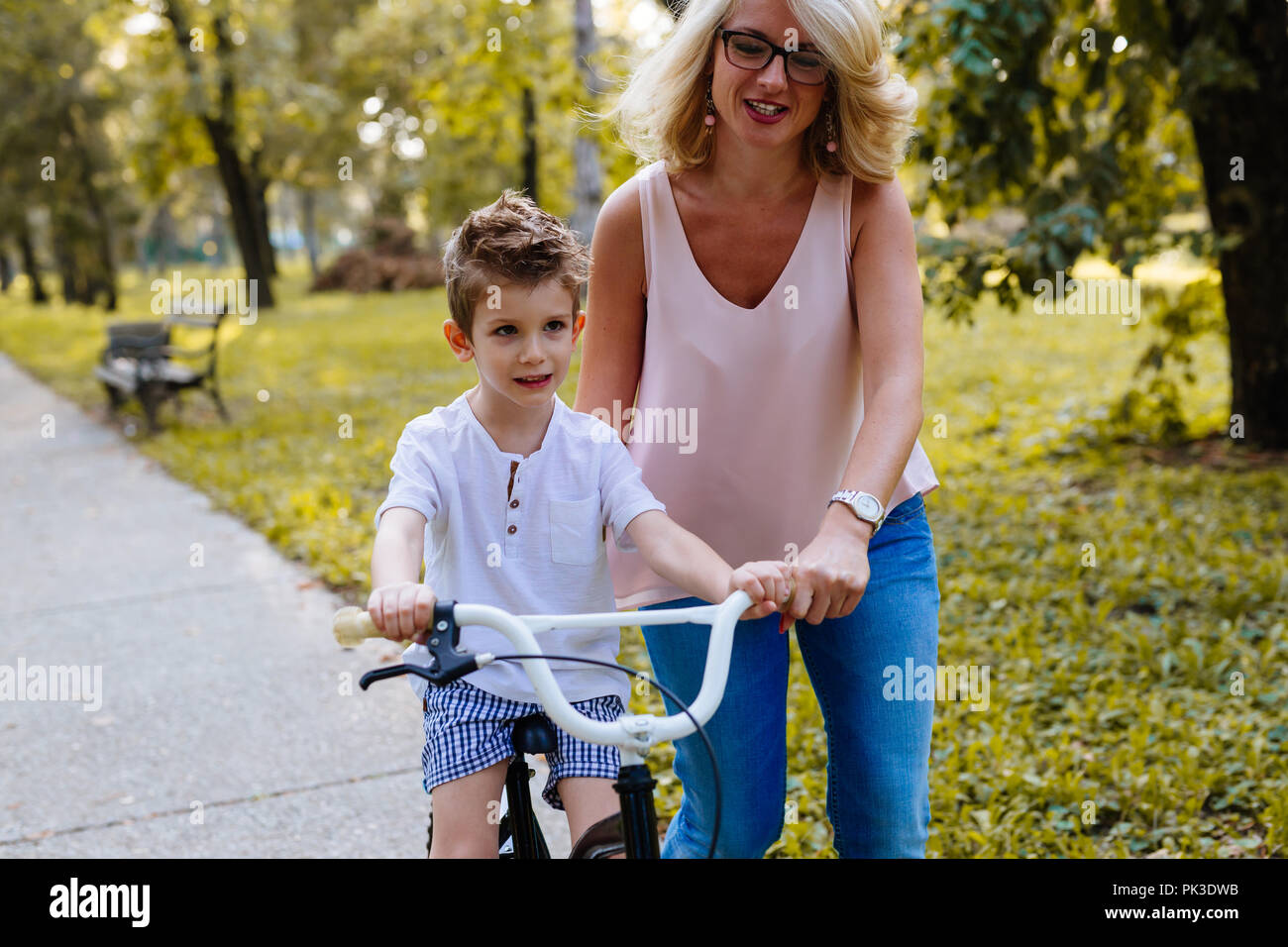 Learning to drive a bicycle Stock Photo - Alamy