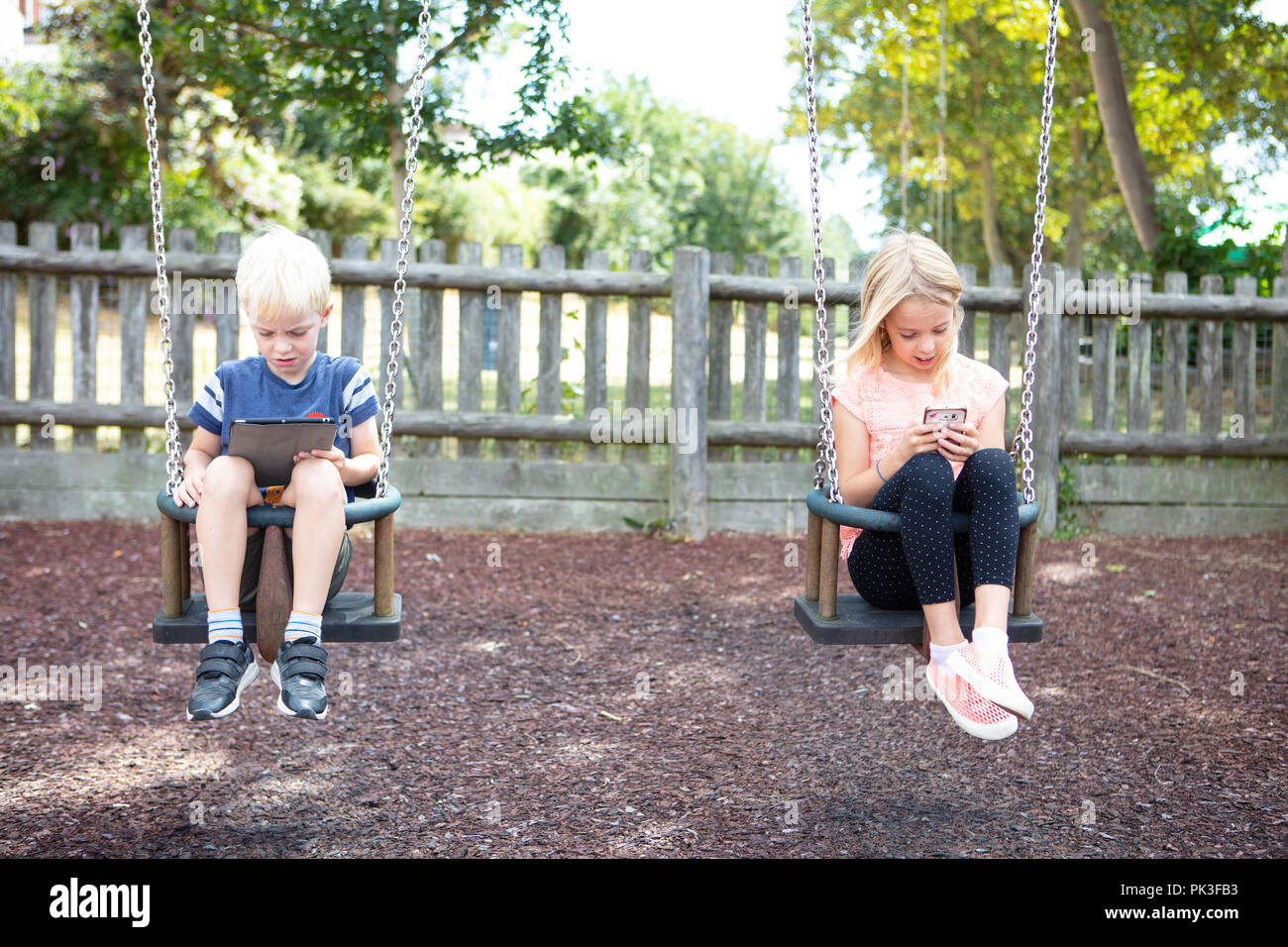 Children using iPad and iPhone Stock Photo - Alamy