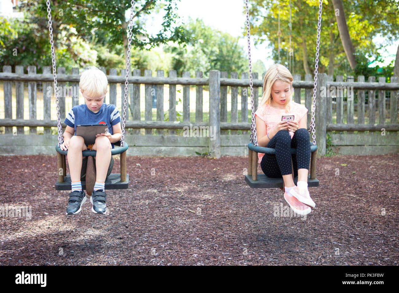Children using iPad and iPhone Stock Photo - Alamy