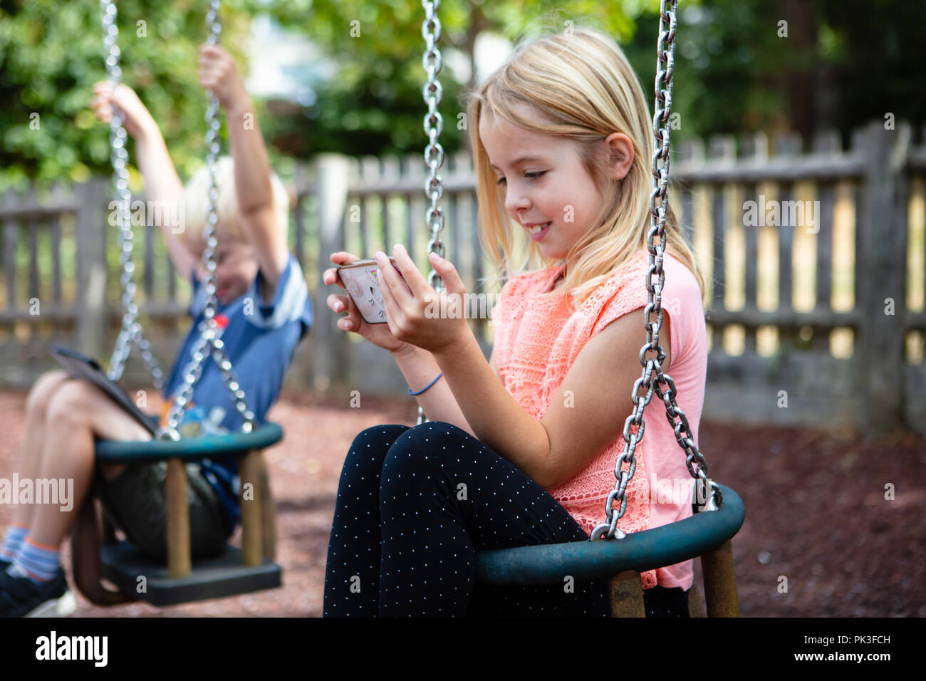 Children using iPad and iPhone Stock Photo - Alamy