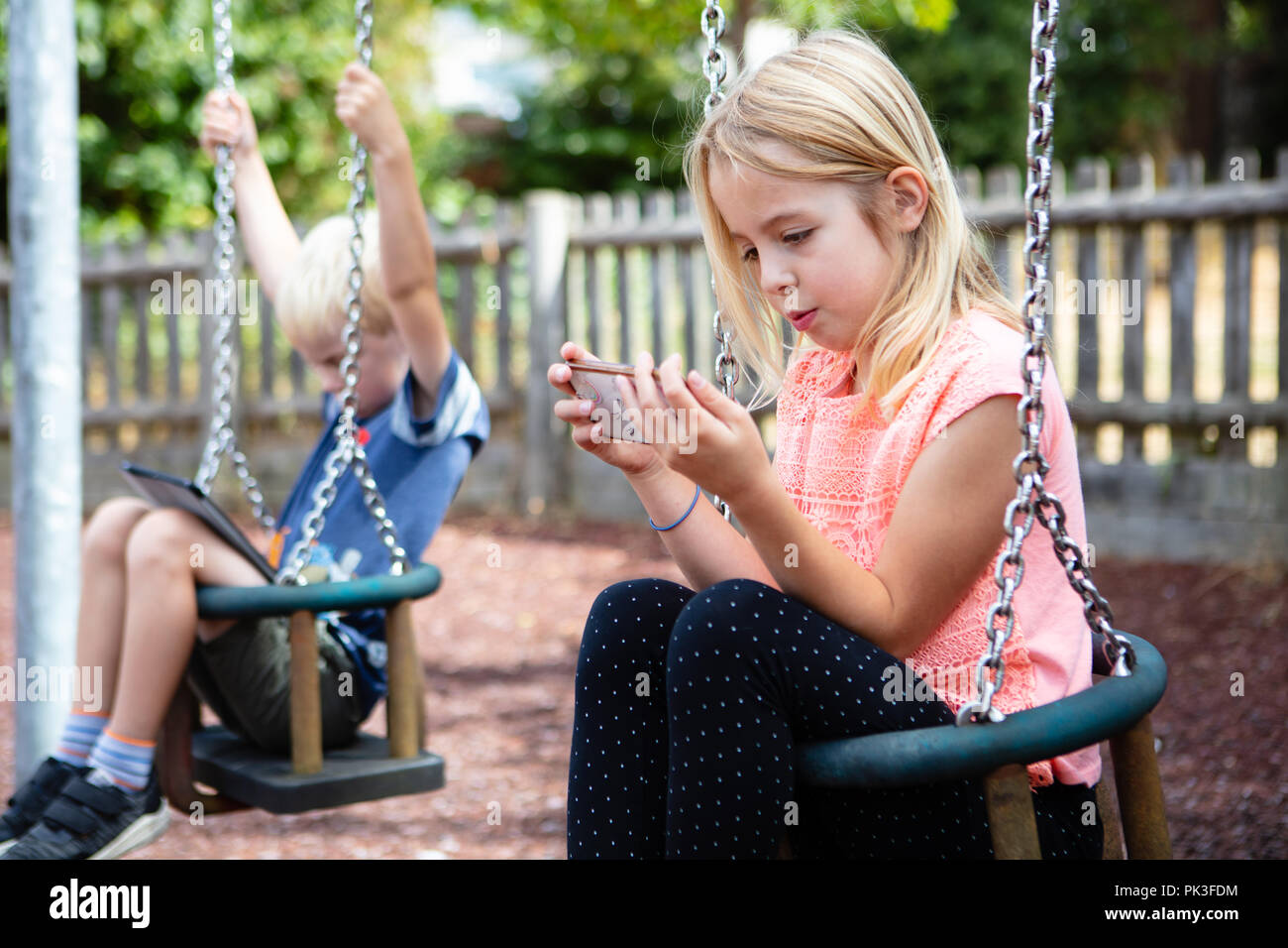 Children using iPad and iPhone Stock Photo - Alamy