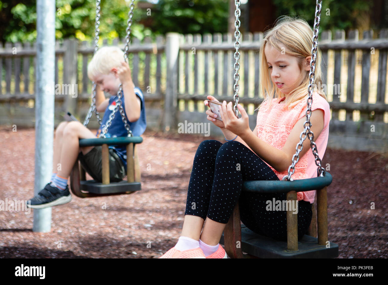 Children using iPad and iPhone Stock Photo - Alamy