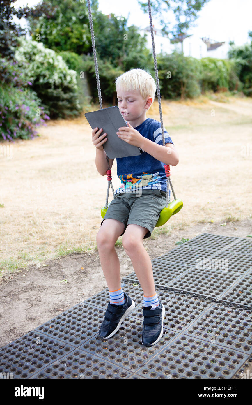 Children using iPad and iPhone Stock Photo - Alamy