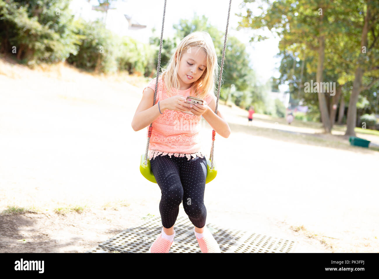 Children using iPad and iPhone Stock Photo - Alamy