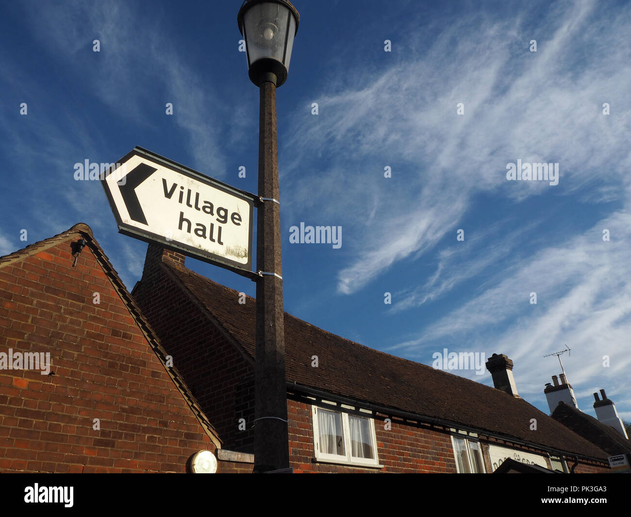 English village hall sign post Stock Photo - Alamy