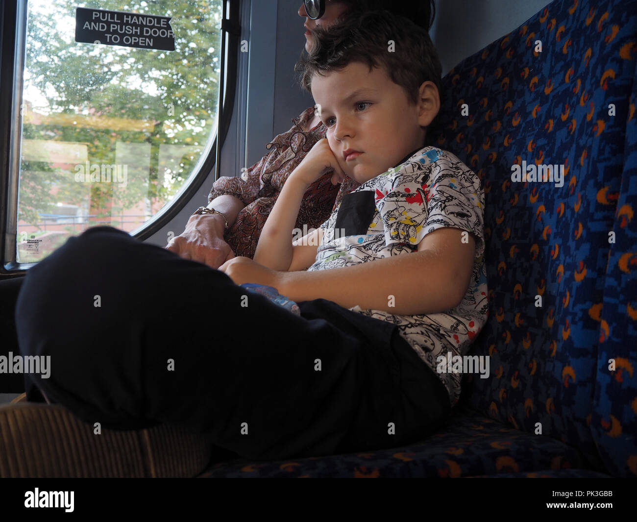 Young child unhappy on a bus Stock Photo - Alamy