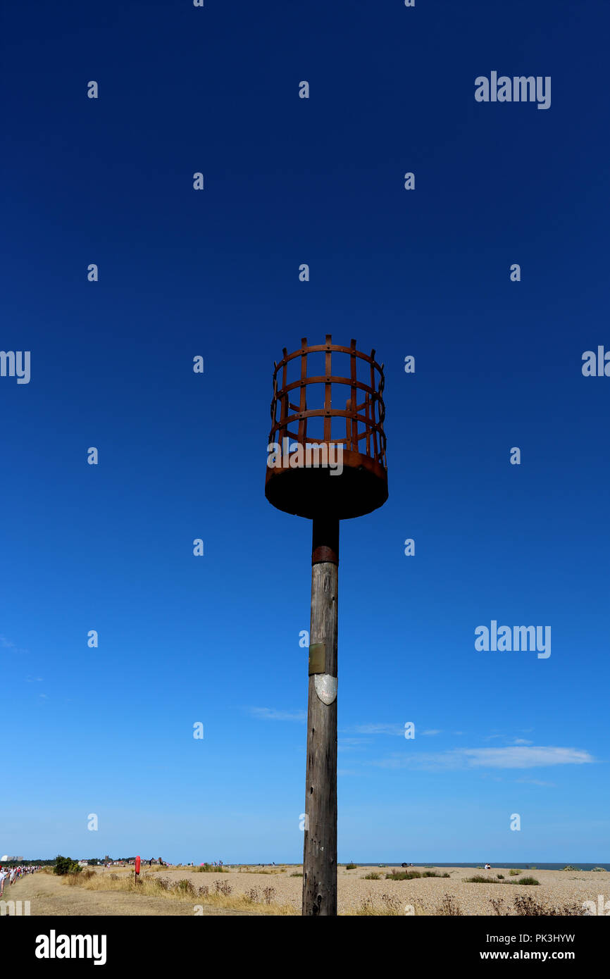An old signalling beacon alongside a track next to the shingle beach at ...