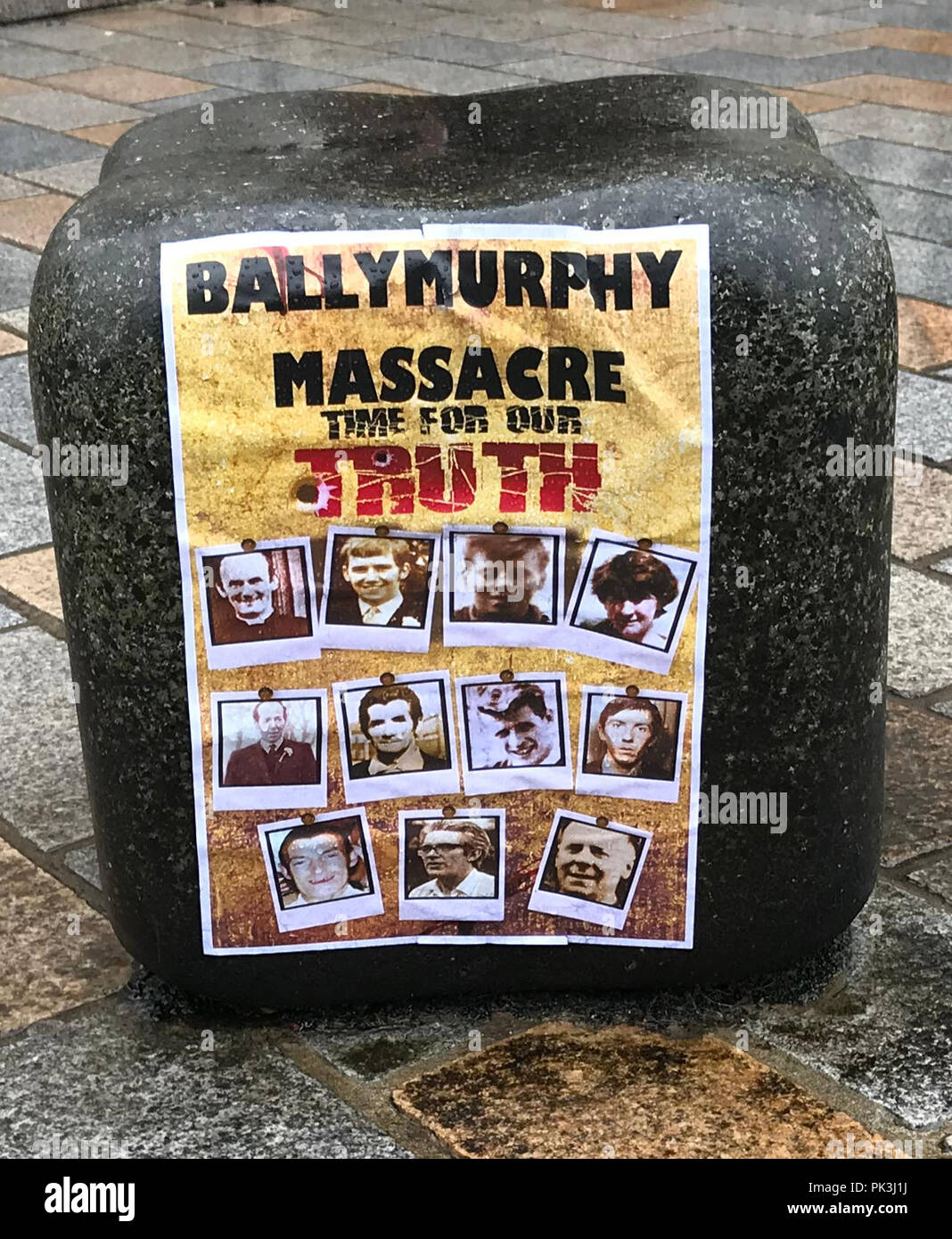 A poster featuring photos of those killed in the Ballymurphy massacre ...
