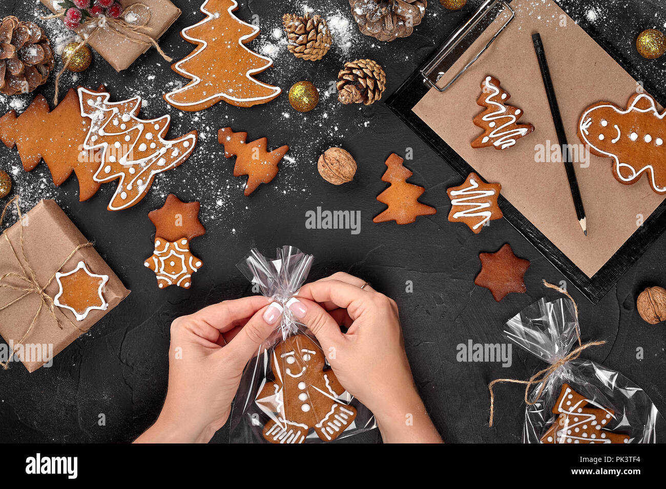 Christmas gift gingerbread on dark background. Biscuits in festive ...