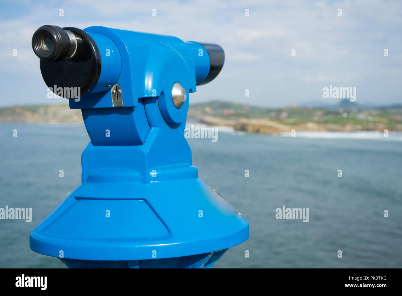 Coin operated binocular on the summer beach, tourist scene in Spain ...