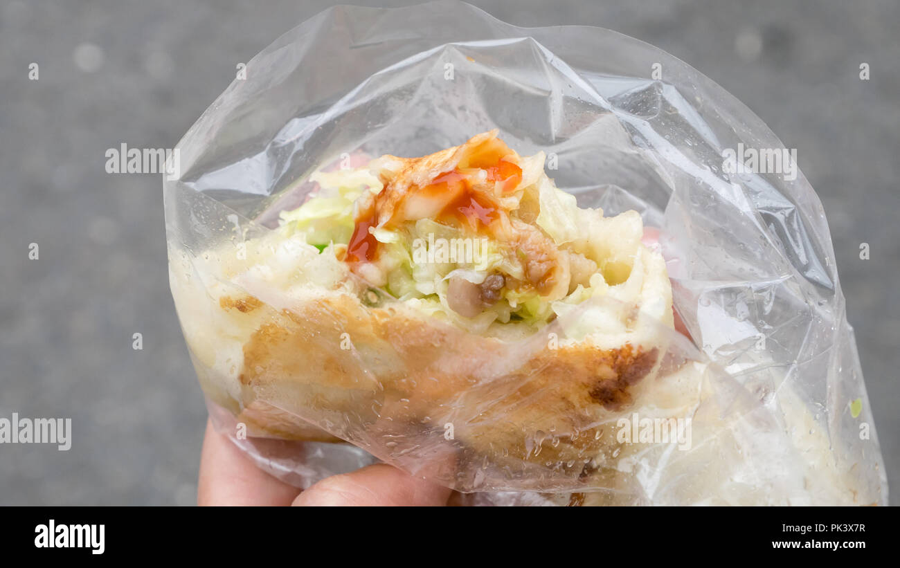 The close up of Taiwanese Steamed Fried Bao (Shui Jian Bao) at street ...