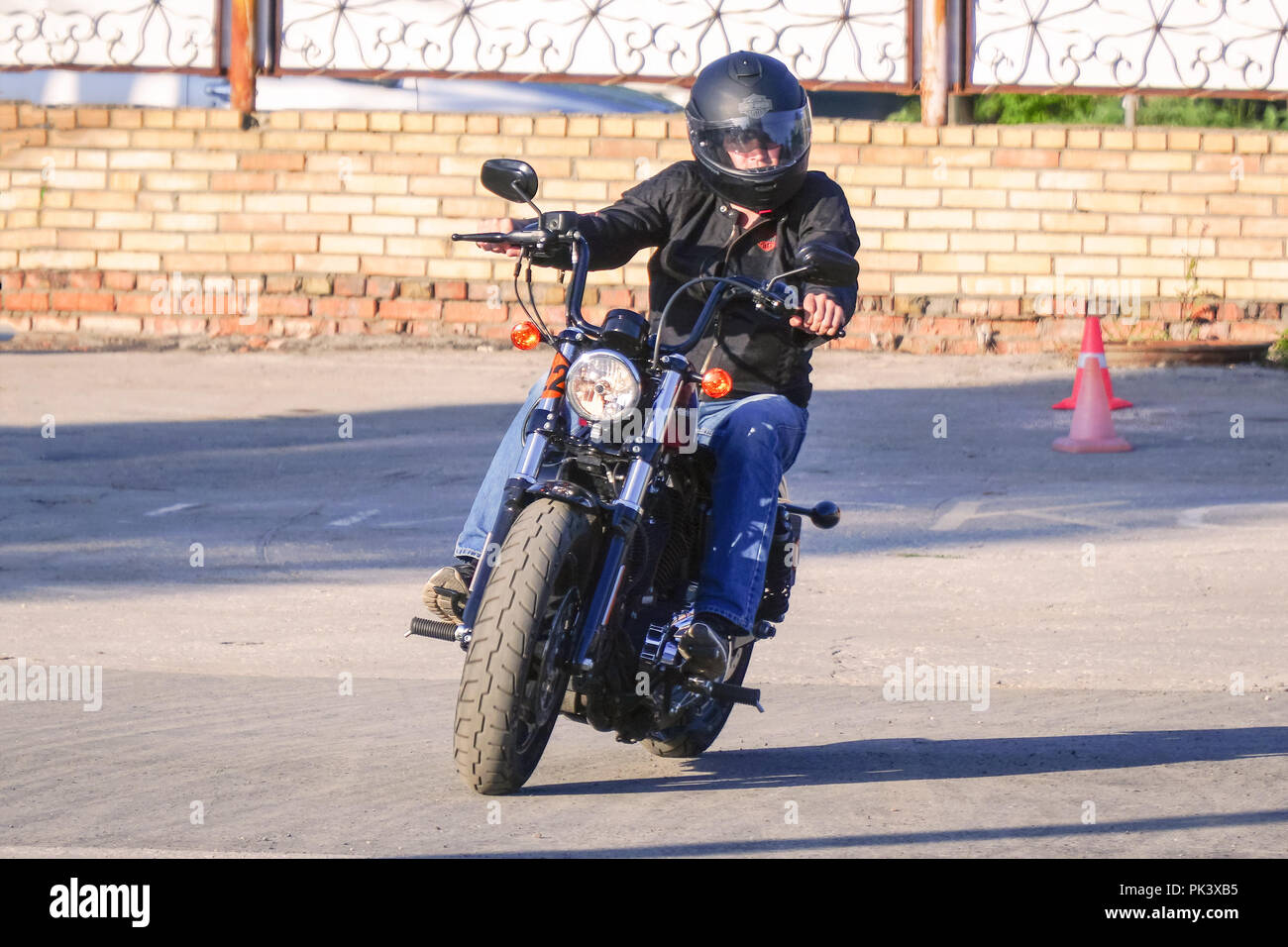 Biker rides a motorcycle Stock Photo - Alamy