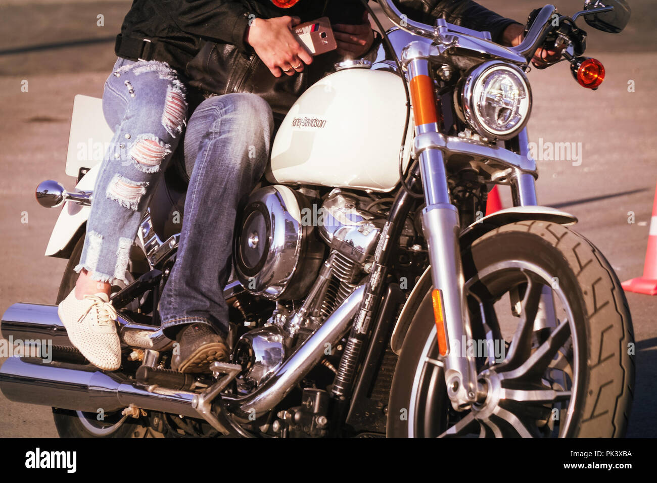 Biker with his girlfriend rides a motorcycle Stock Photo - Alamy