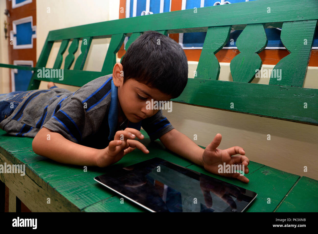 Little boy playing with digital tablet Stock Photo - Alamy