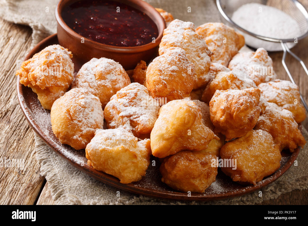 Homemade petulla fried dough with raspberry jam and powdered sugar ...