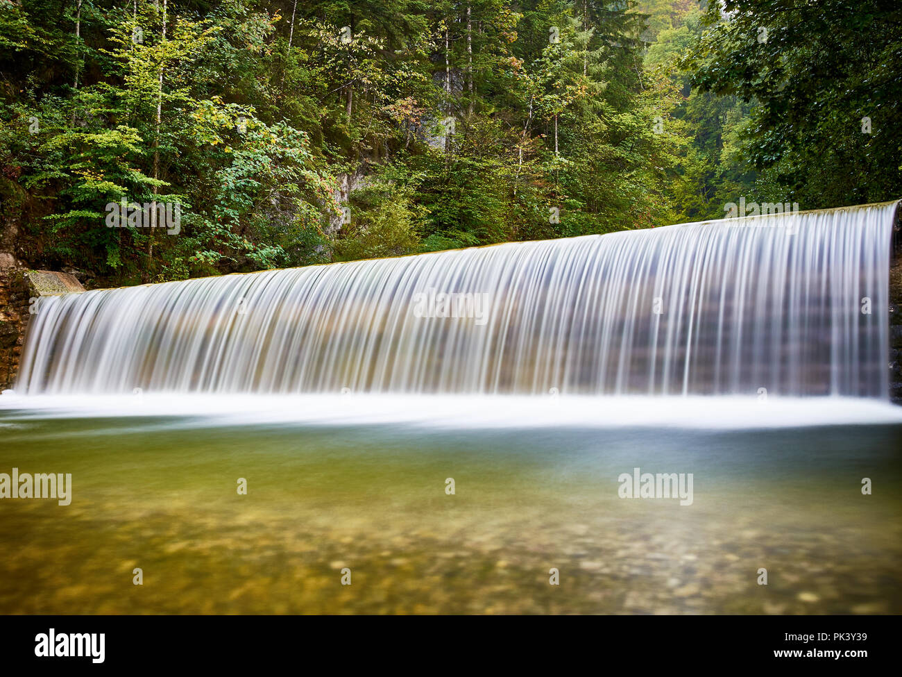Detailed view of a water slide or a waterfall with blurred water, with ...