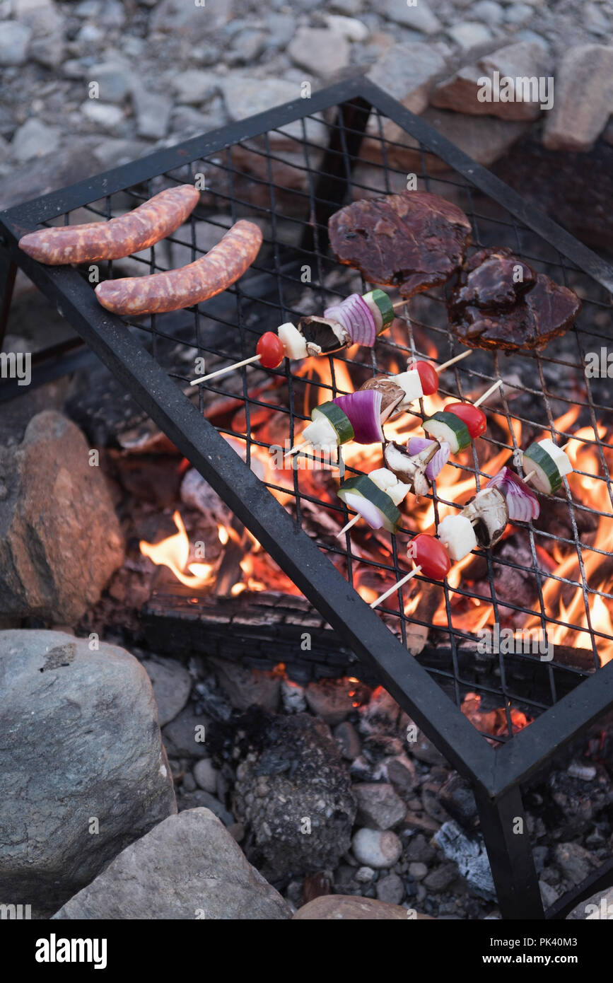 Food kept on a barbecue at campsite Stock Photo - Alamy