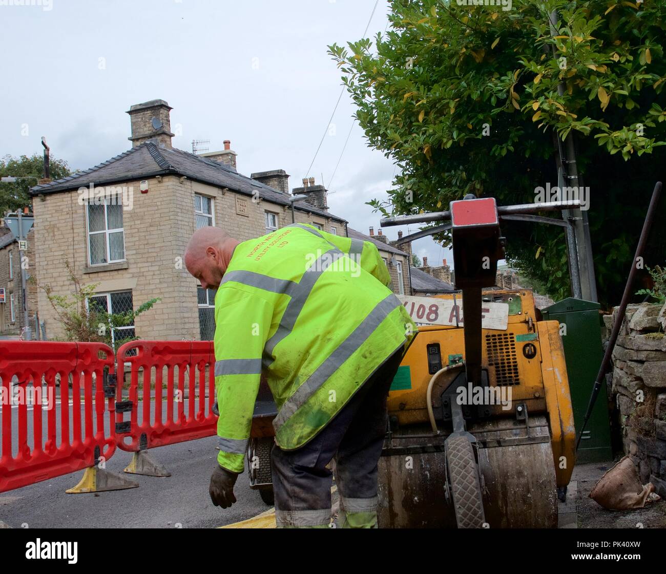 men working on a pavement Stock Photo - Alamy
