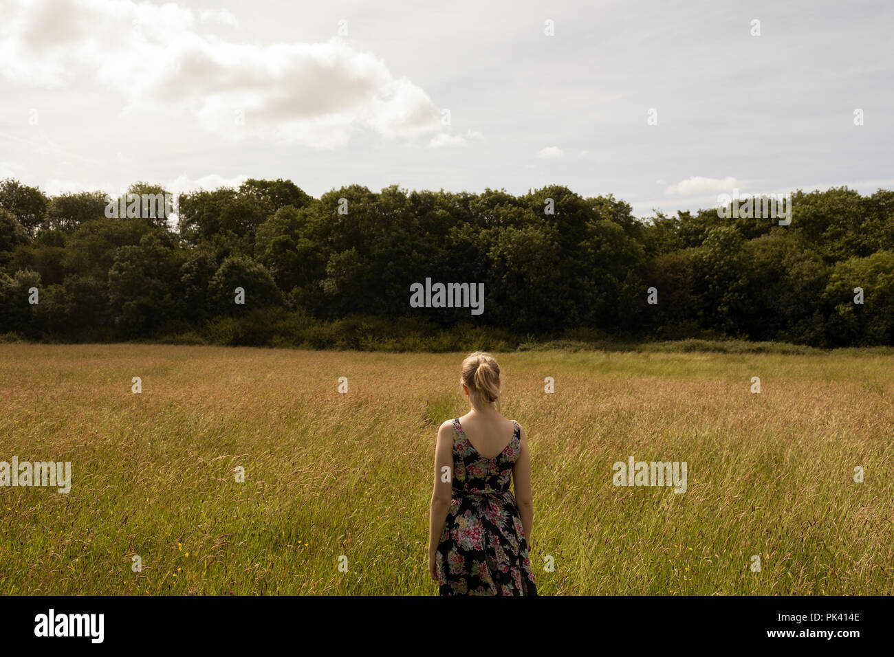 Woman standing field hi-res stock photography and images - Alamy