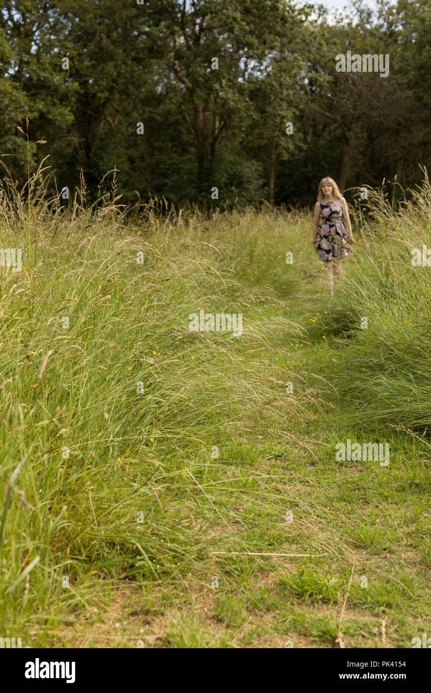 Beautiful young woman walking field hi-res stock photography and images ...