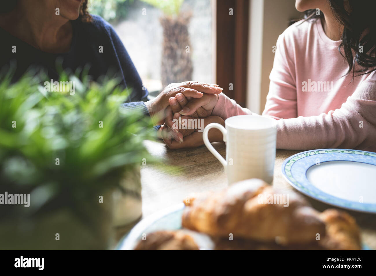 Mother and daughter consoling each other at home Stock Photo - Alamy