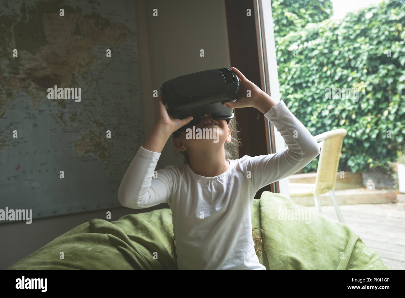 Girl using vr headset sitting hi-res stock photography and images - Alamy