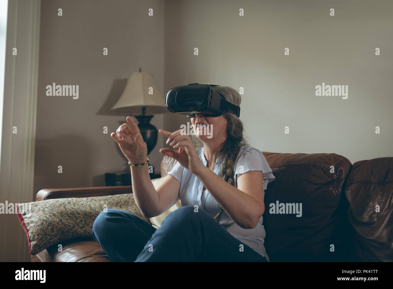 Vr mature senior woman headset hi-res stock photography and images - Alamy