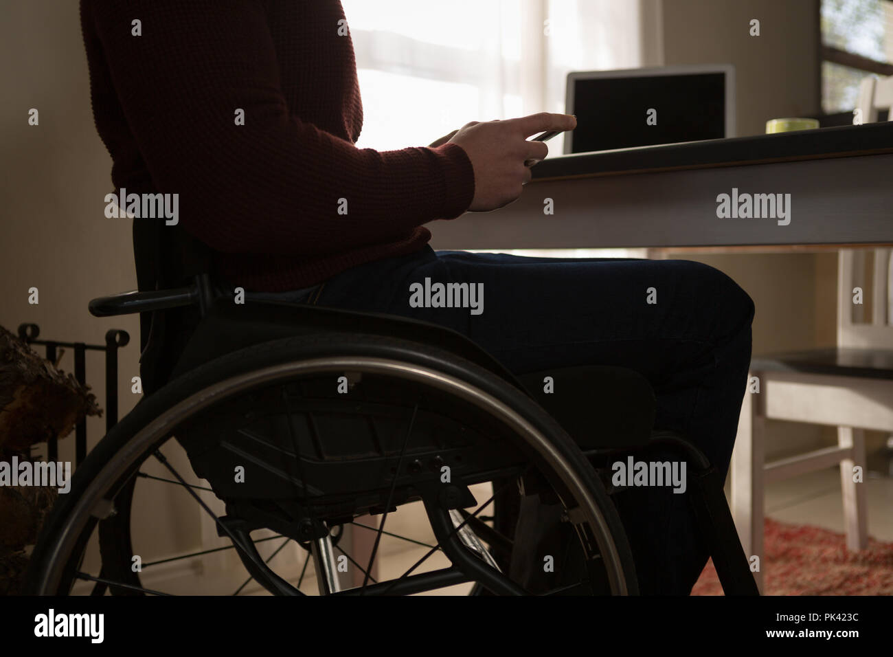 Disabled man using computer typing hi-res stock photography and images ...