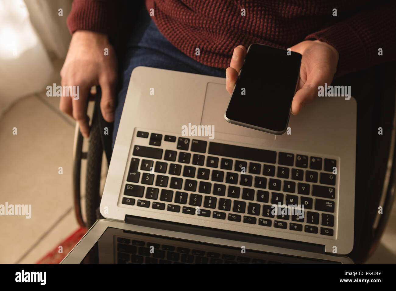 Disabled man using computer typing hi-res stock photography and images ...