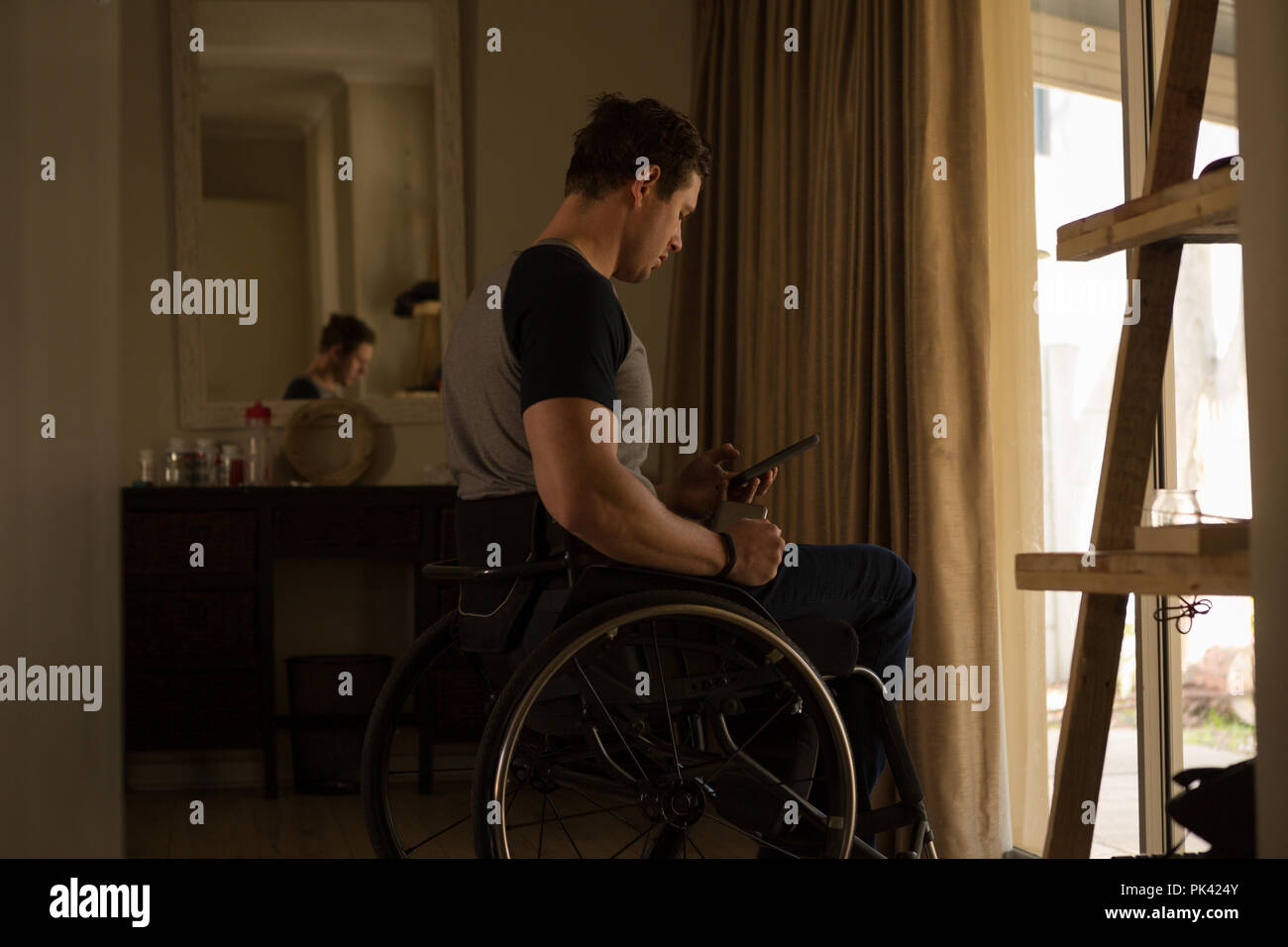 Disabled man using mobile phone Stock Photo - Alamy