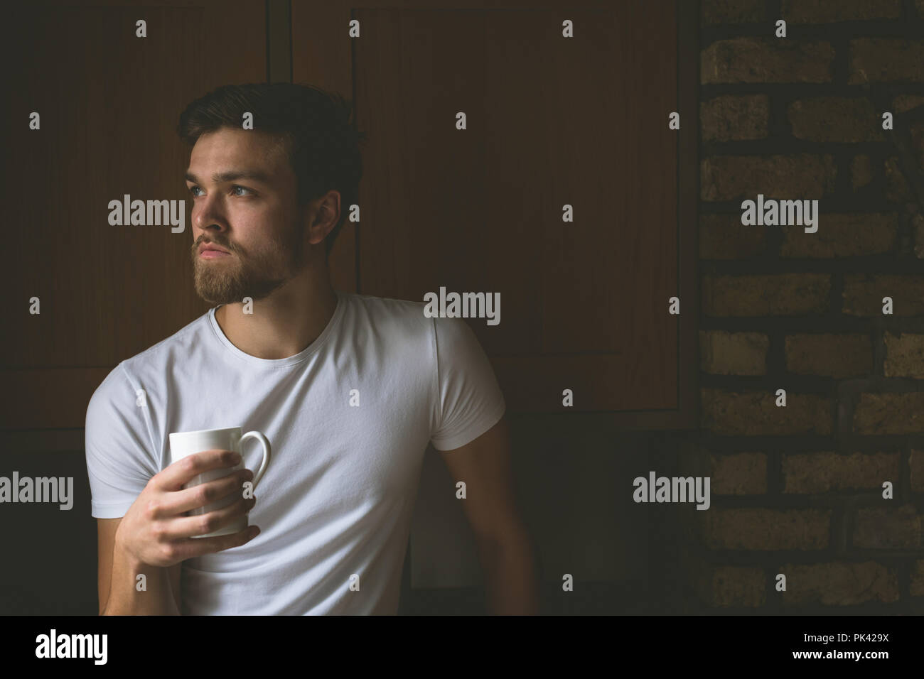 Young man having coffee home hi-res stock photography and images - Alamy