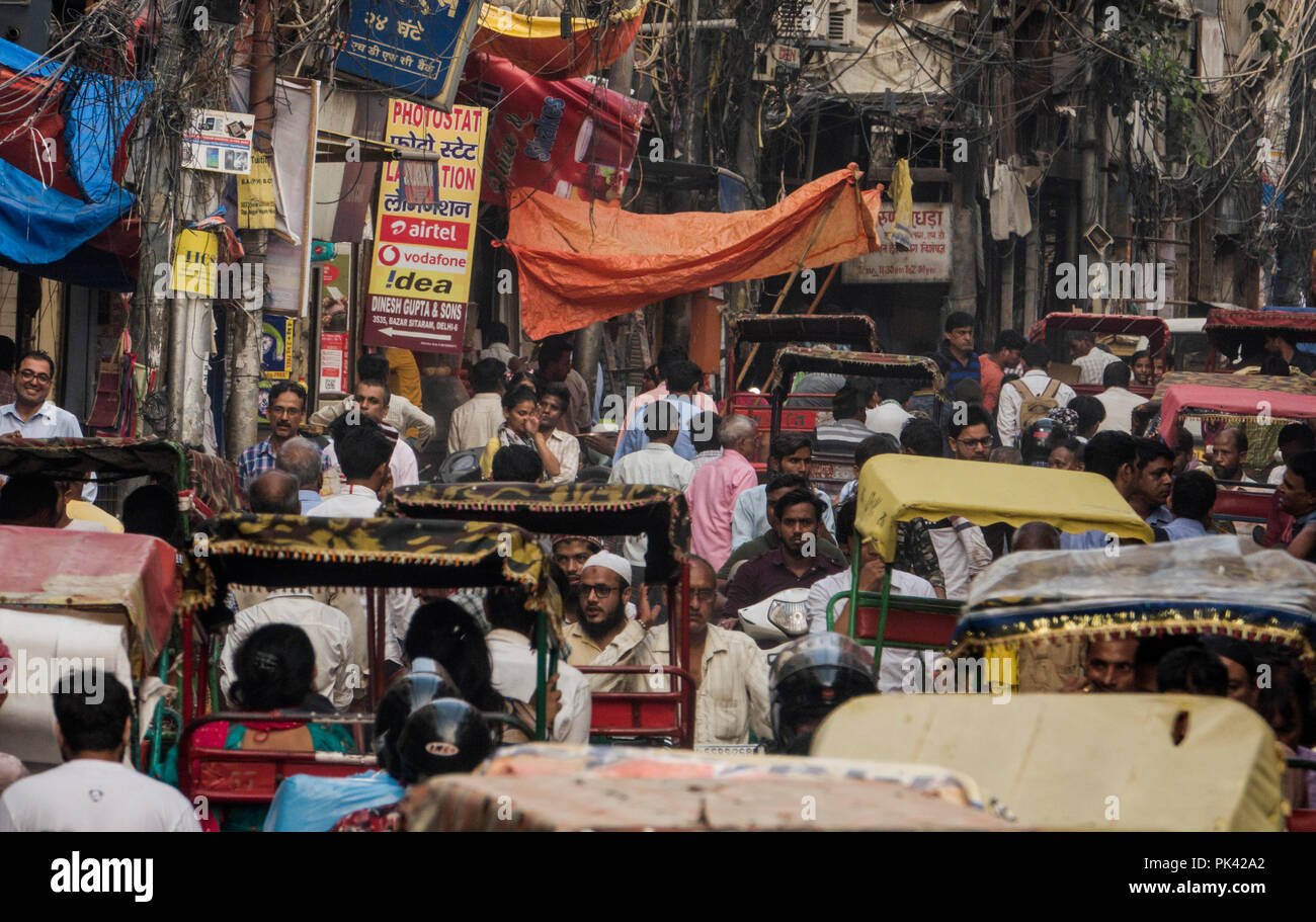 Rickshaw and pedestrian traffic in crowded street scene in Old Delhi ...