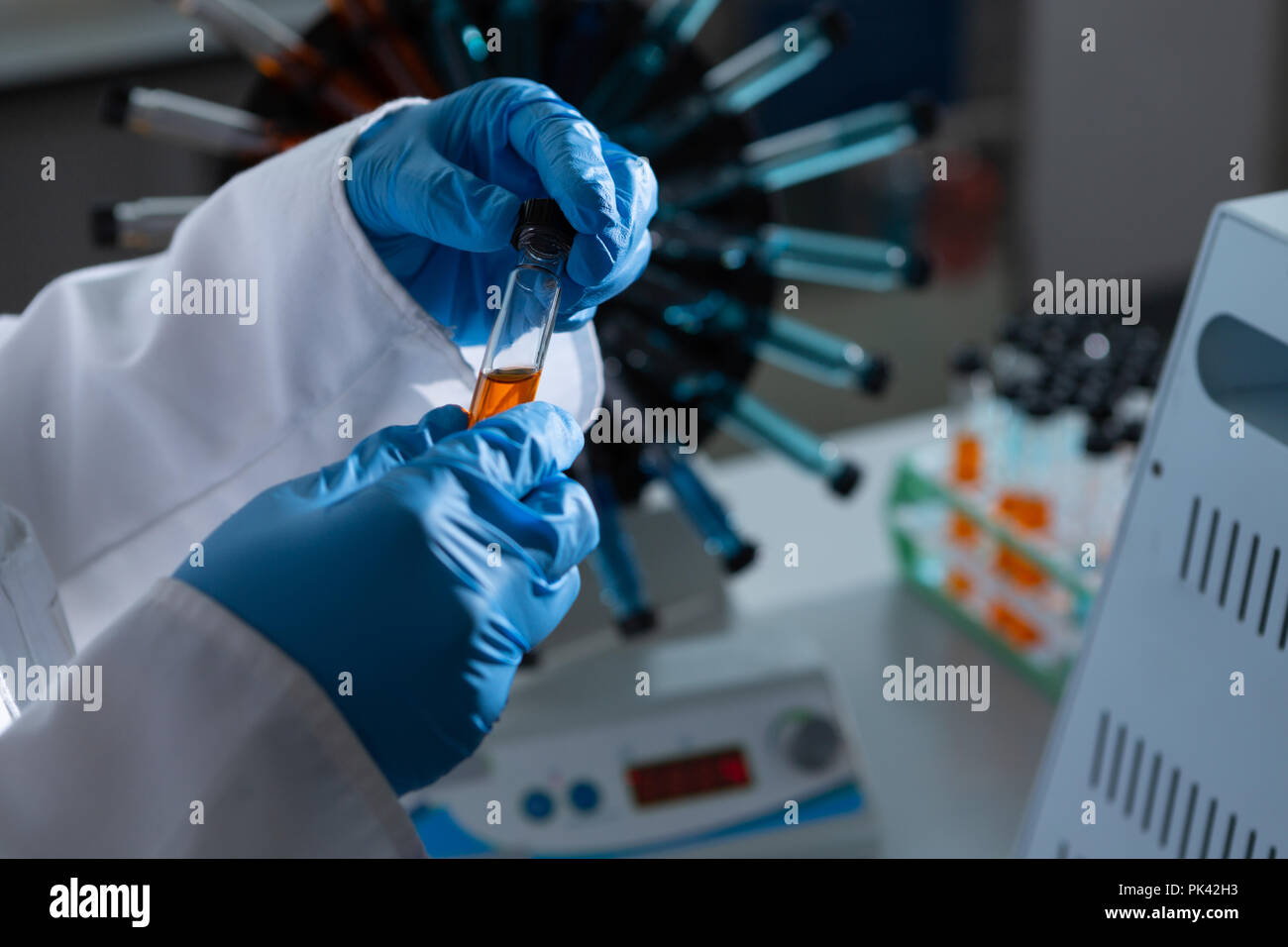Scientist holding sample test tube hi-res stock photography and images ...