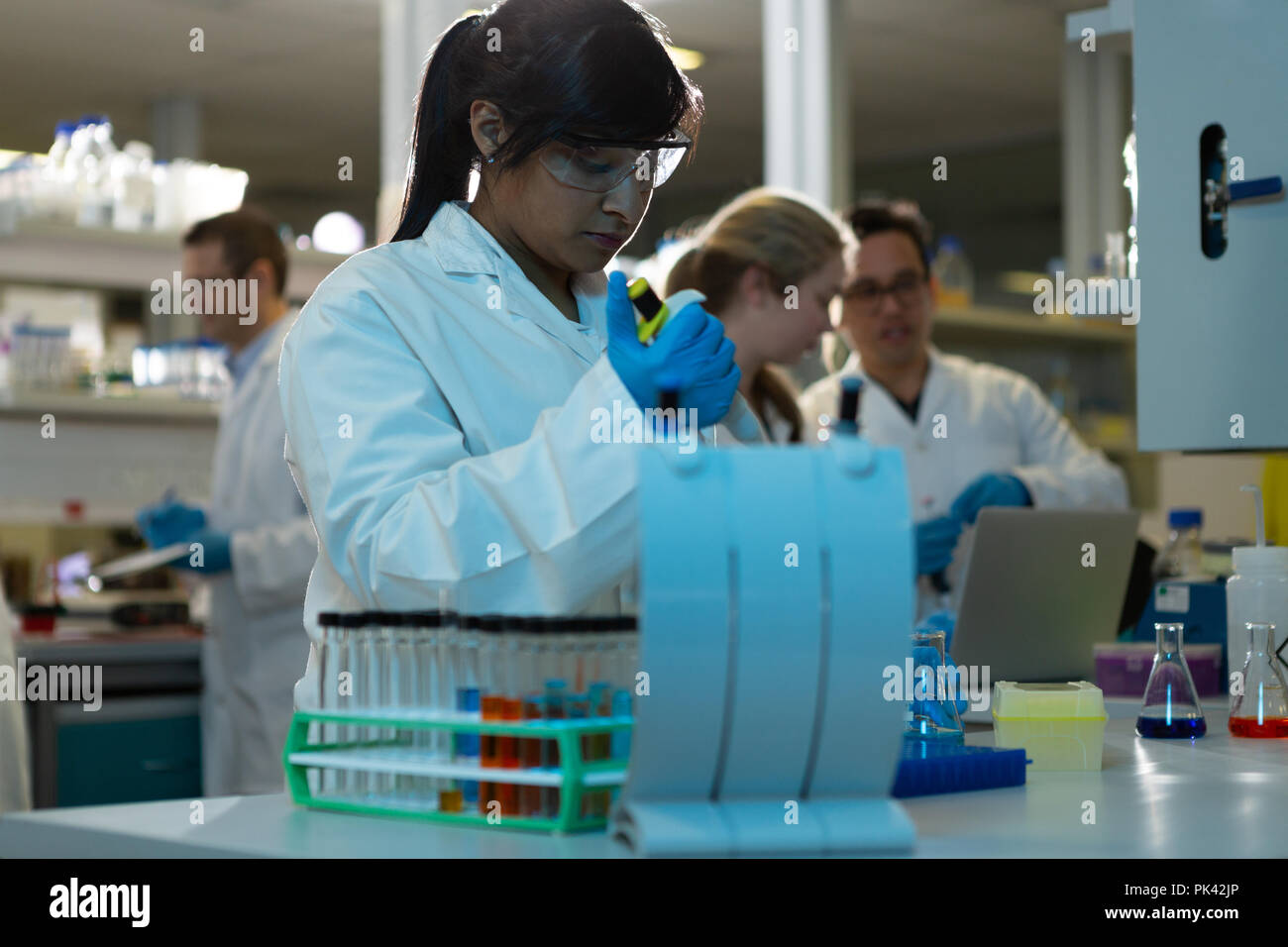 Scientist Using Pipette In Laboratory High Resolution Stock Photography ...