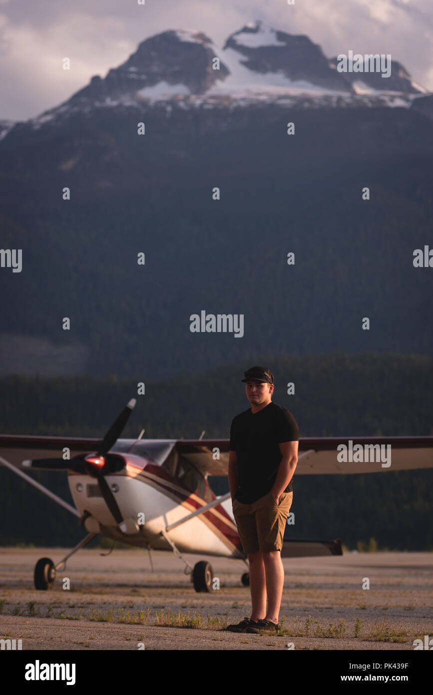 Pilot standing near aircraft Stock Photo - Alamy