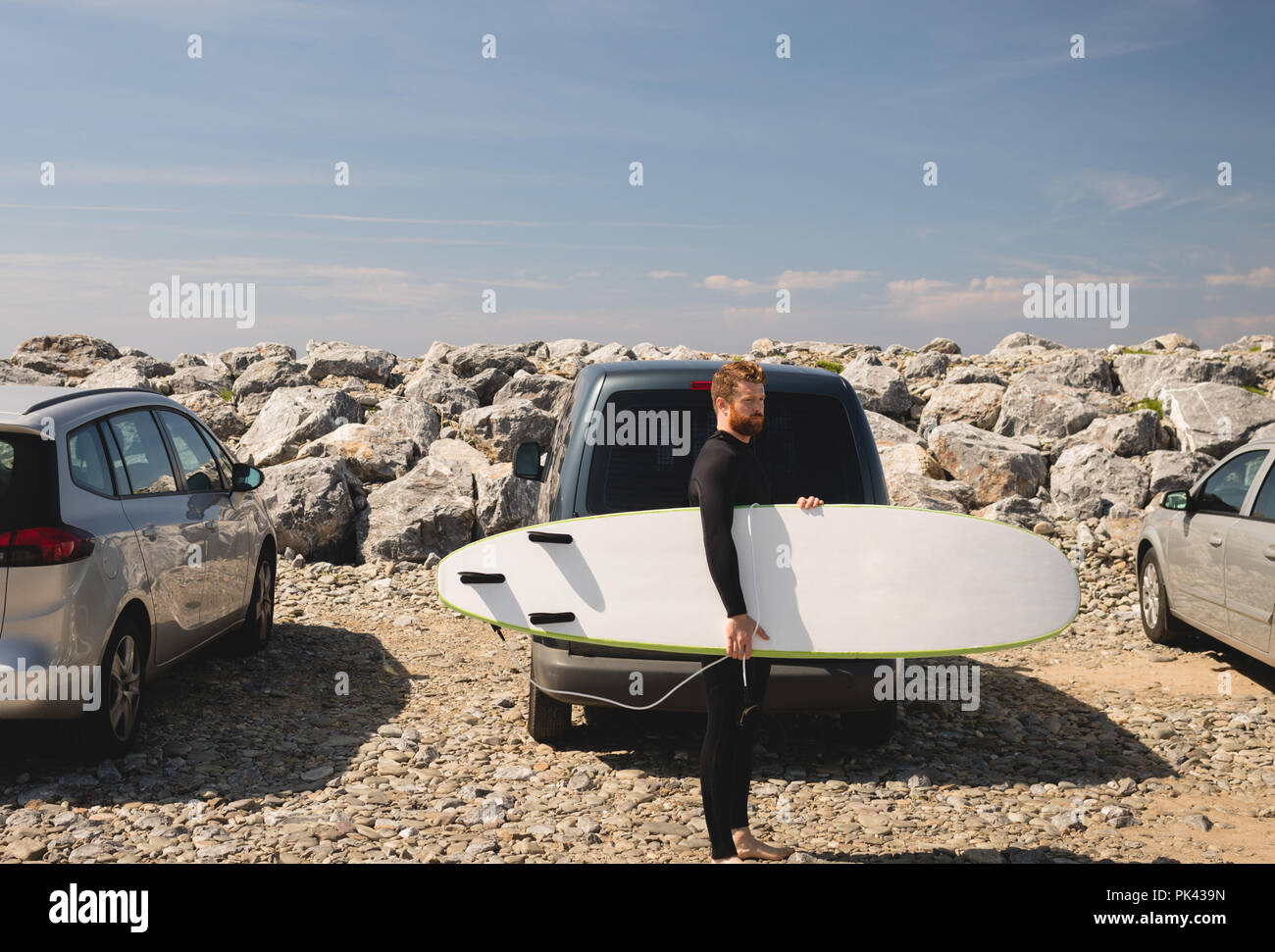 Surfer holding surfboard hi-res stock photography and images - Alamy