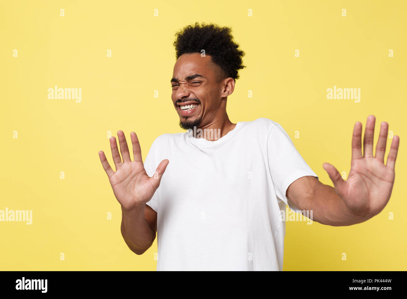 Closeup portrait of shocked mad young man raising hands up to say no ...