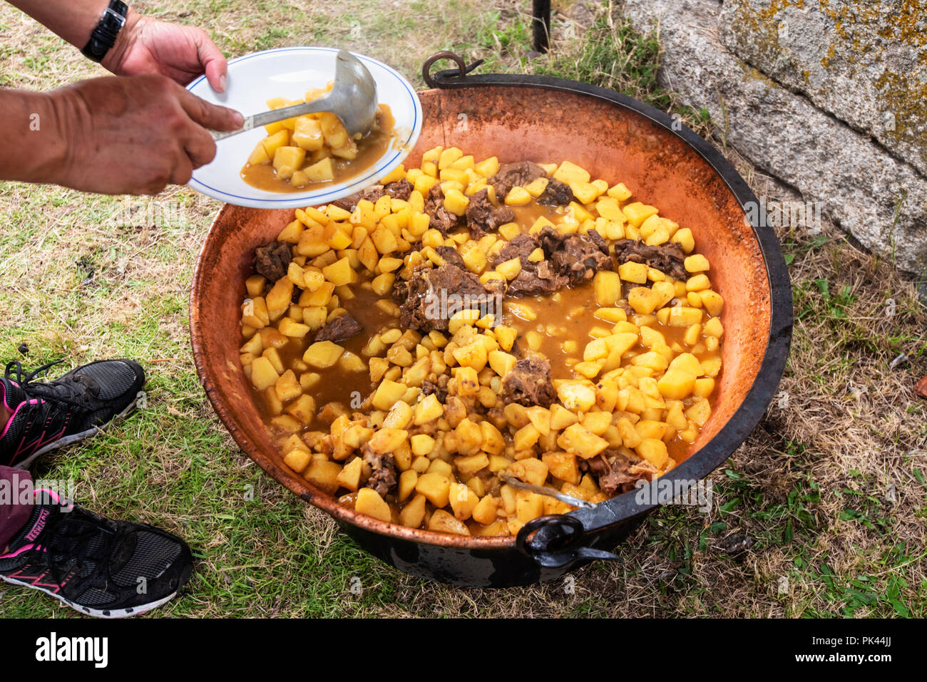 Chanfana, a traditional dish made with roasted old goat, potatoes, red ...