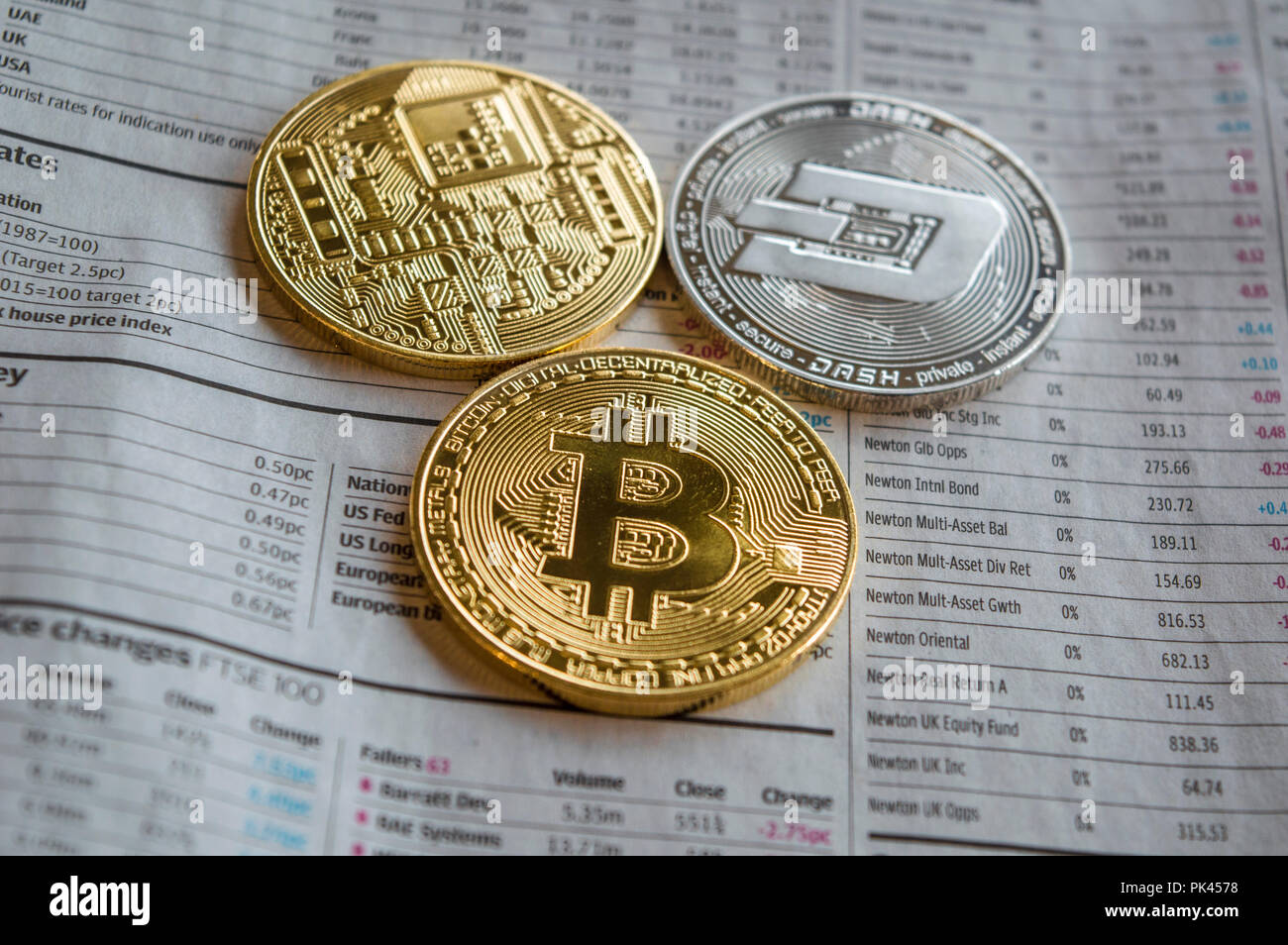 Golden bitcoins and dollar notes on newspaper Stock Photo - Alamy