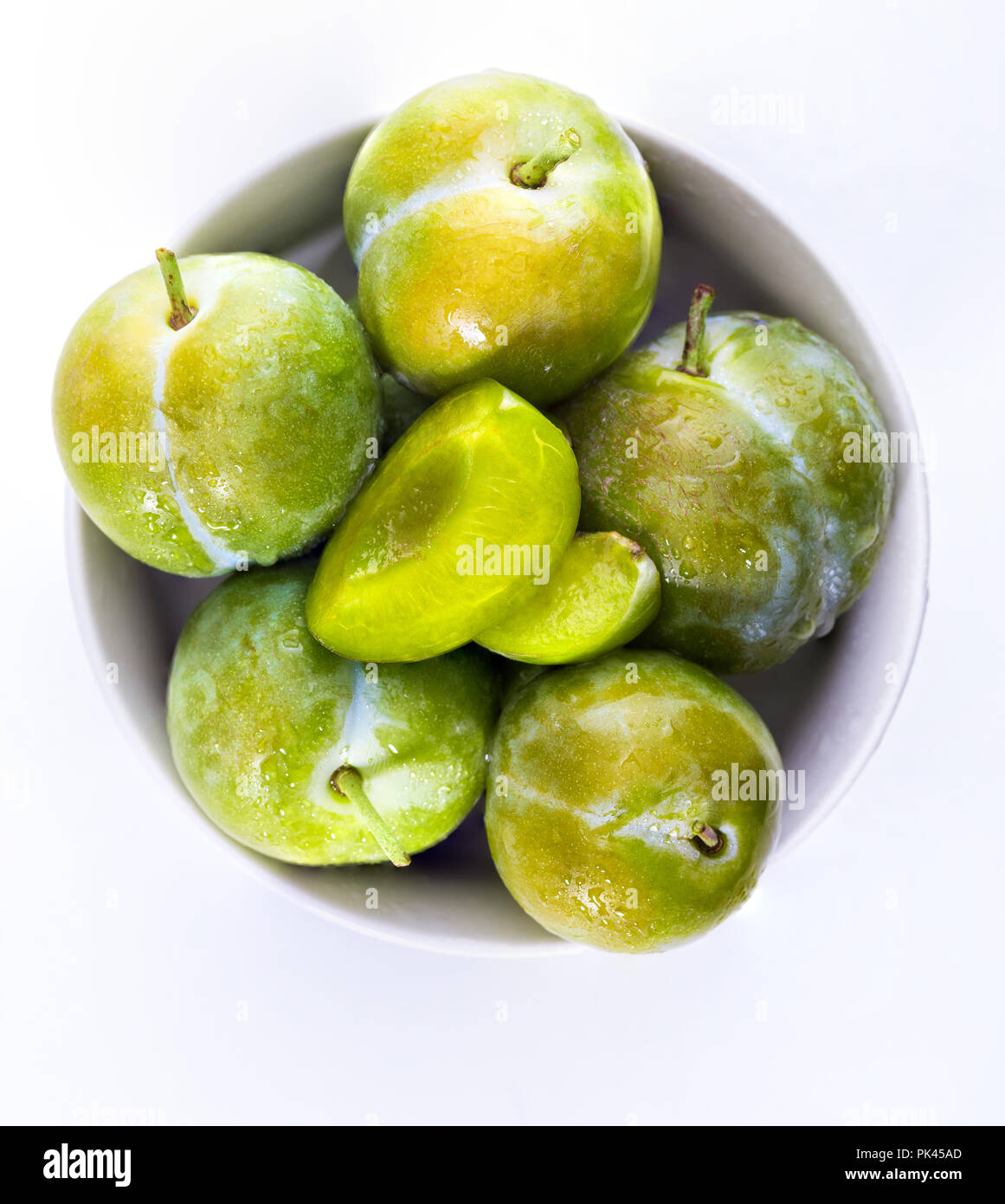 Delicious green plums fresh and raw claudias. Isolated on white ...