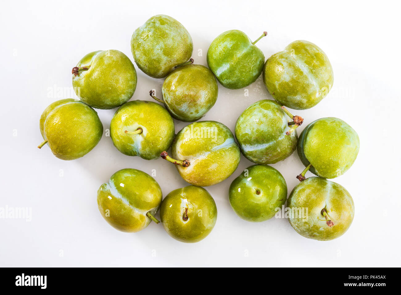 Delicious green plums fresh and raw claudias. Isolated on white ...