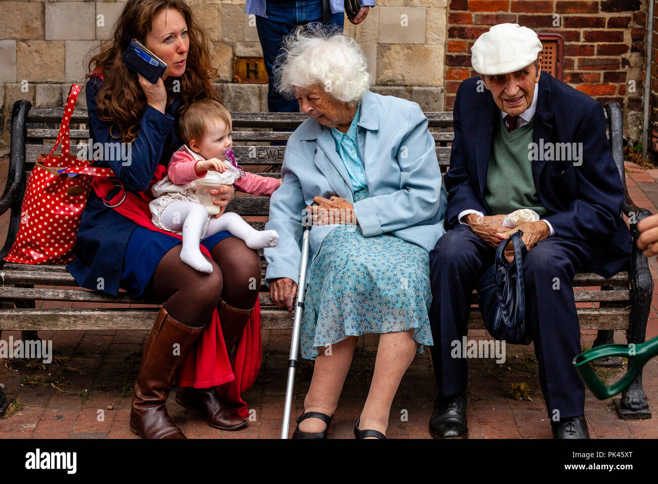 Local People Sitting On A Public Bench, High Street, Lewes, East Sussex ...